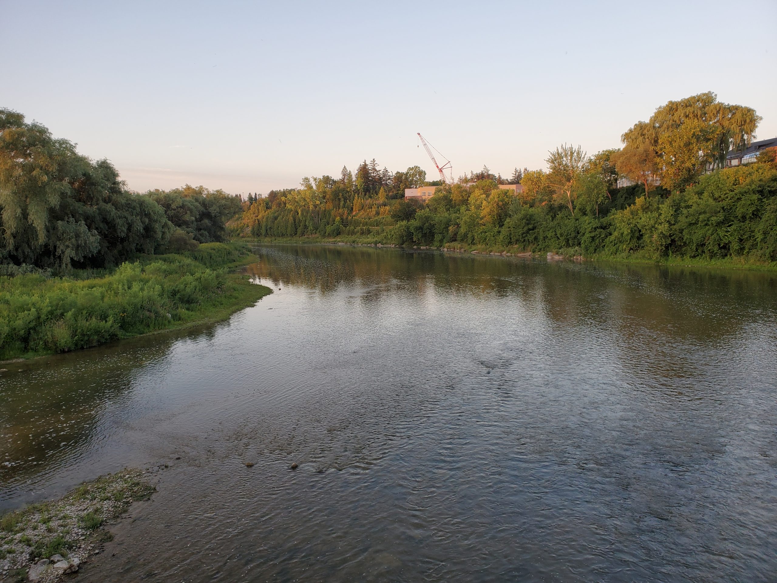Police investigating after vehicle drives into Grand River