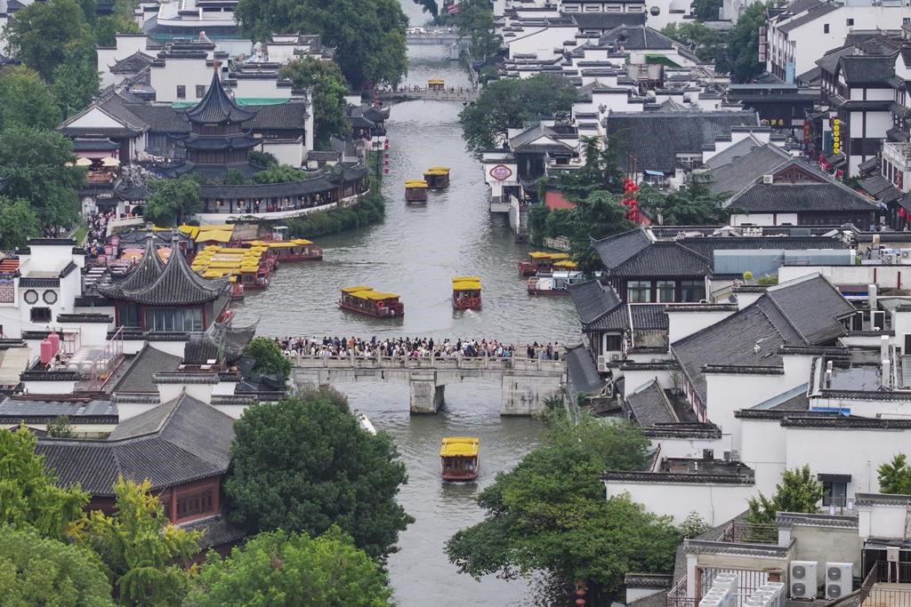 China's flagging economy gets a temporary boost as holiday travel ...