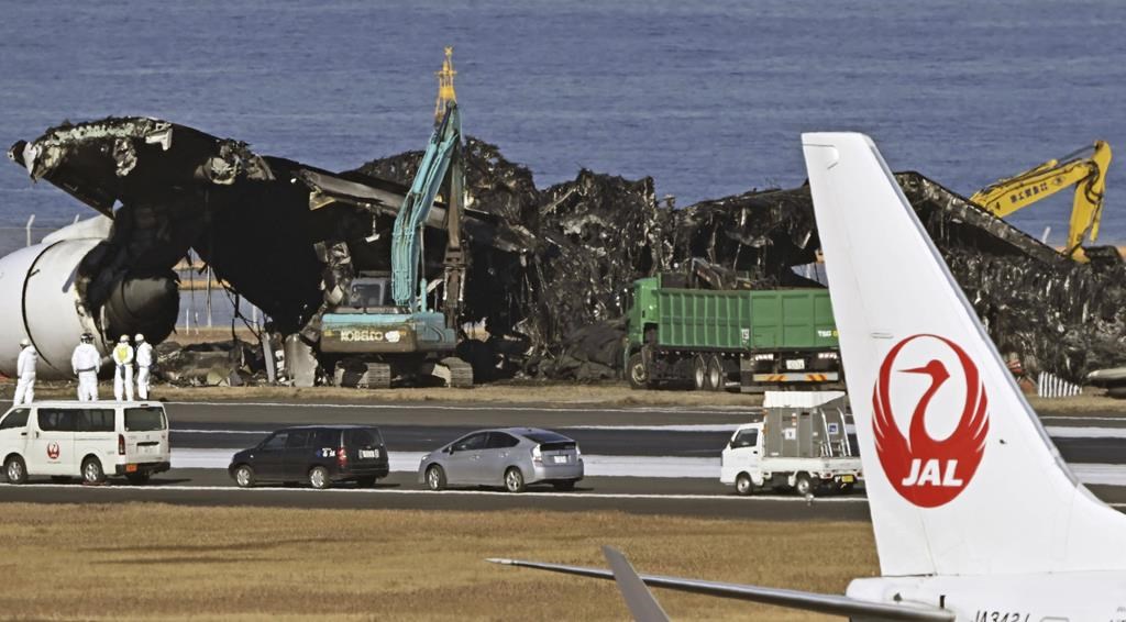 Japanese safety experts search for voice data as workers clear plane ...