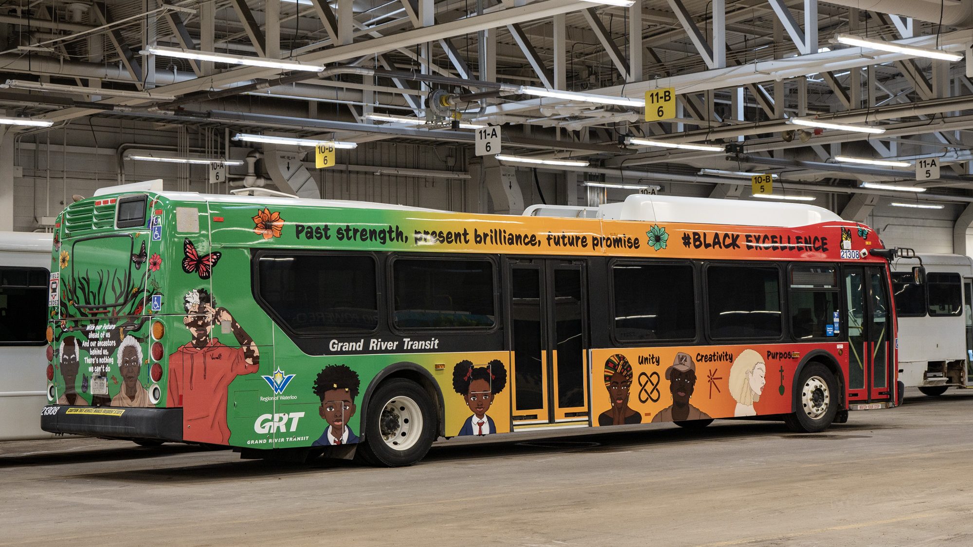 Laurier student behind the new bus wrap at GRT